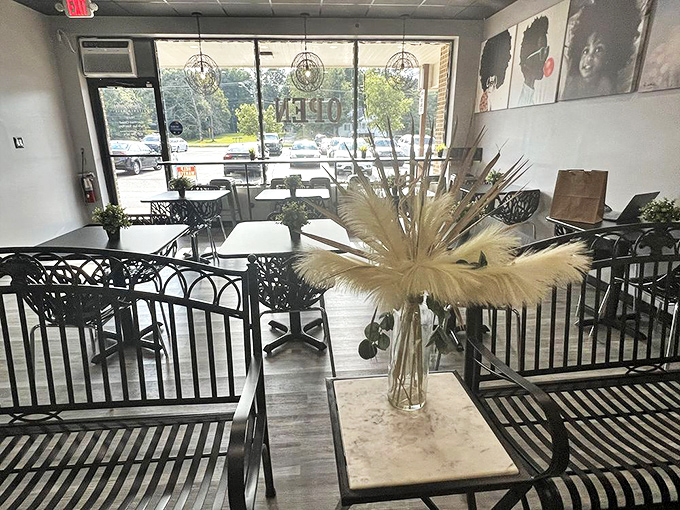 Airy and inviting, the dining space balances modern design with cozy touches, including that statement floral arrangement.