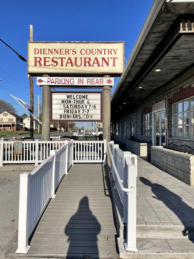 The sign stands as a beacon for hungry travelers, with that white ramp promising accessibility for all who seek authentic country cooking.