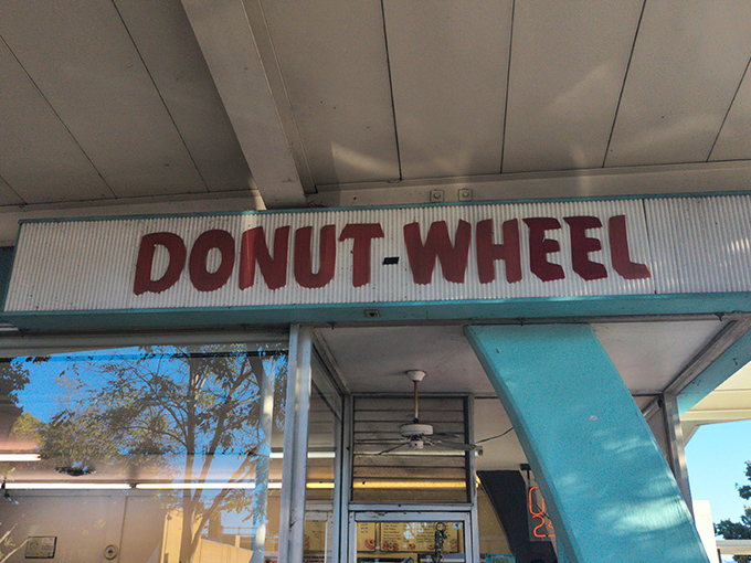 That vintage sign with its distinctive lettering has guided hungry travelers to donut nirvana for decades. Some landmarks need no explanation.