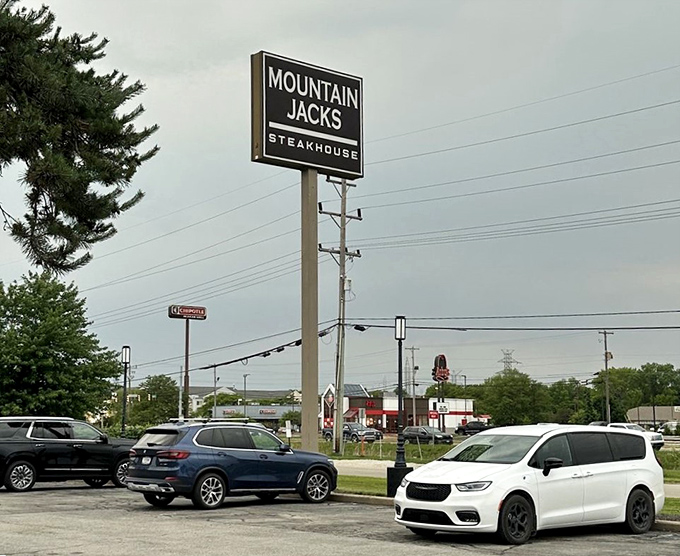 The roadside sign stands tall, a beacon for hungry travelers. It's not flashy, but neither was Paul Newman, and everyone loved him.