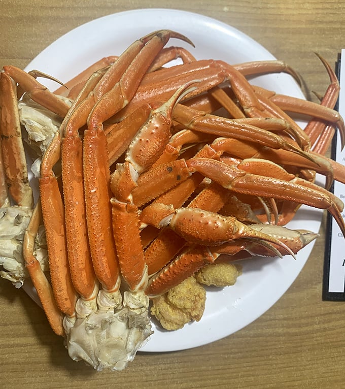 Snow crab legs arranged like nature's perfect puzzle&mdash;requiring equal parts strategy, determination, and melted butter to solve.