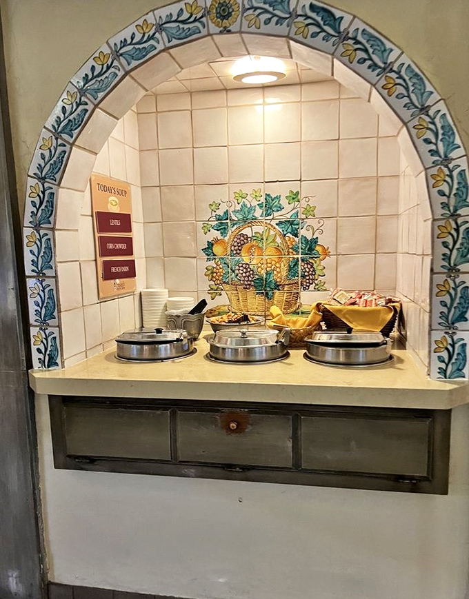 This tiled alcove houses today's soups – liquid comfort in ceramic vessels, waiting to warm souls and kickstart appetites for the journey ahead.