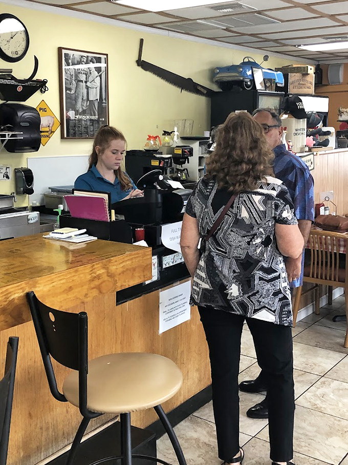 Staff members efficiently take orders while regulars wait patiently. The rhythm of a well-loved restaurant plays out every morning.