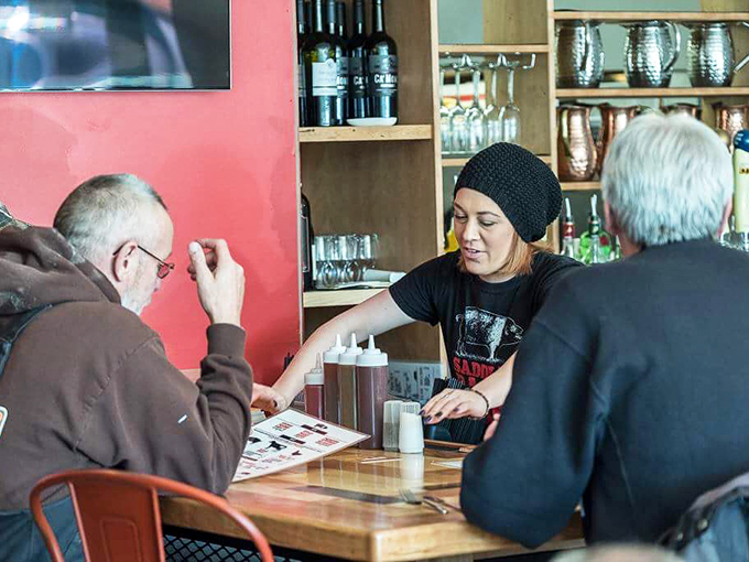 The sacred exchange between barbecue enthusiast and server—a ritual as important as the smoking process itself.