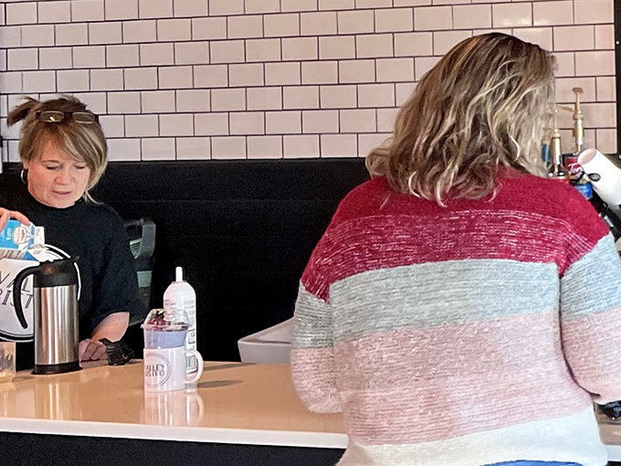 Where the magic happens: staff focused on crafting your breakfast dreams into delicious reality.