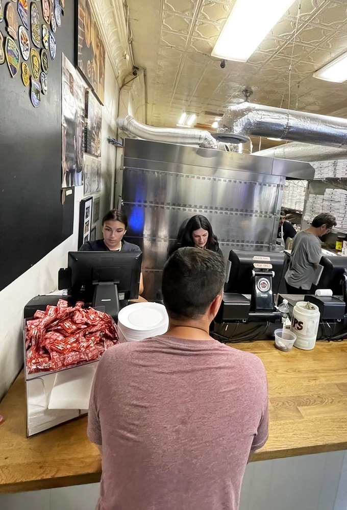 Behind the scenes, where the magic happens. Every great sandwich has a story, and it begins with these dedicated hands.