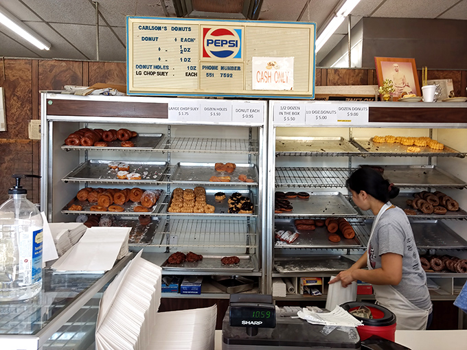 The quiet ballet of donut service&mdash;practiced hands ensuring that Maryland mornings start with the right balance of sugar, dough, and happiness.