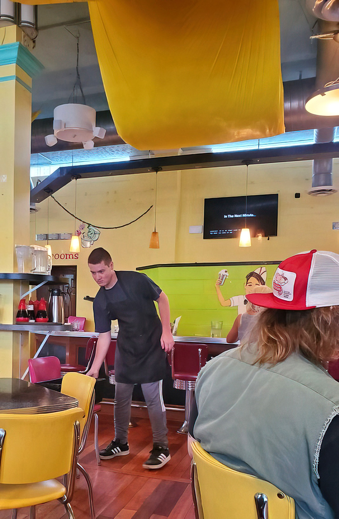 Staff moving with the choreographed precision of people who know that breakfast is serious business.