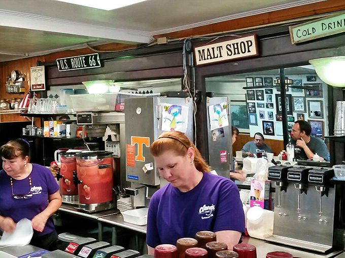 The purple-shirted staff moves with practiced precision. These breakfast maestros orchestrate your morning meal with Southern efficiency.