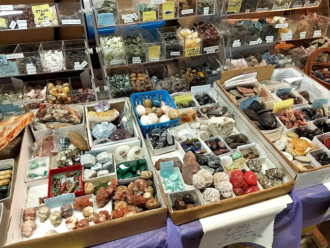 Nature's jewelry box spilled open&mdash;crystals, geodes, and polished stones organized with scientific precision. Earth's artwork, millions of years in the making.