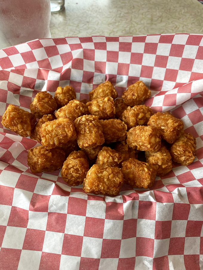 Tater tots that crunch like autumn leaves but taste like potato perfection. The ultimate comfort food in bite-sized form.