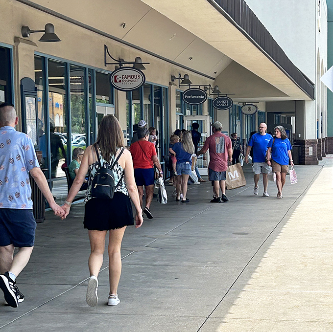 The true Tanger experience: shoppers with bags in hand, comfortable shoes on feet, and the determined look of people on a mission.