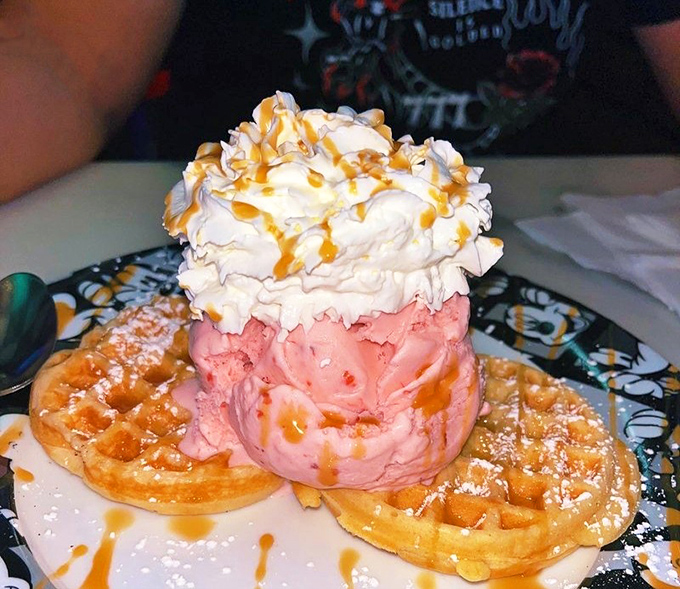 Waffle sundae architecture 101: Build your foundation with golden waffles, add a scoop of strawberry, crown with whipped cream, and drizzle with caramel.