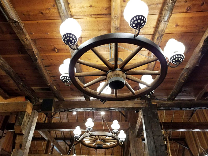 Not just lighting &ndash; a conversation piece. This wagon wheel chandelier transforms ordinary dining into a rustic celebration of American ingenuity.