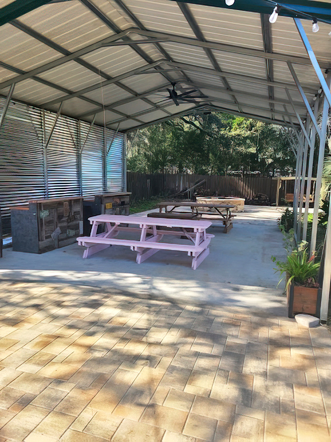 The covered outdoor seating area&mdash;where the Florida sunshine is invited to the barbecue party but kept at a respectful distance.