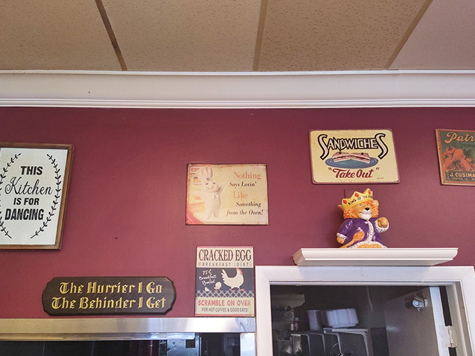 Wall d&eacute;cor that tells you everything you need to know: "This Kitchen is for Dancing" and "The Hurrier I Go, The Behinder I Get."