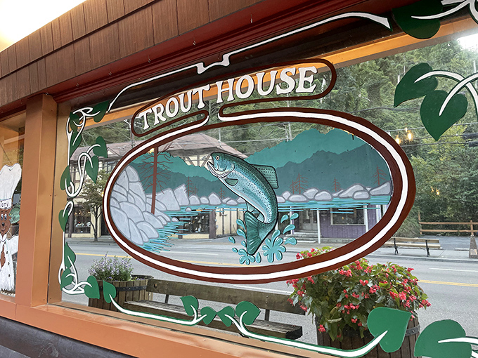 This artful window decoration captures the spirit of the place &ndash; a leaping trout against mountain scenery, promising the freshest catch this side of catching it yourself.