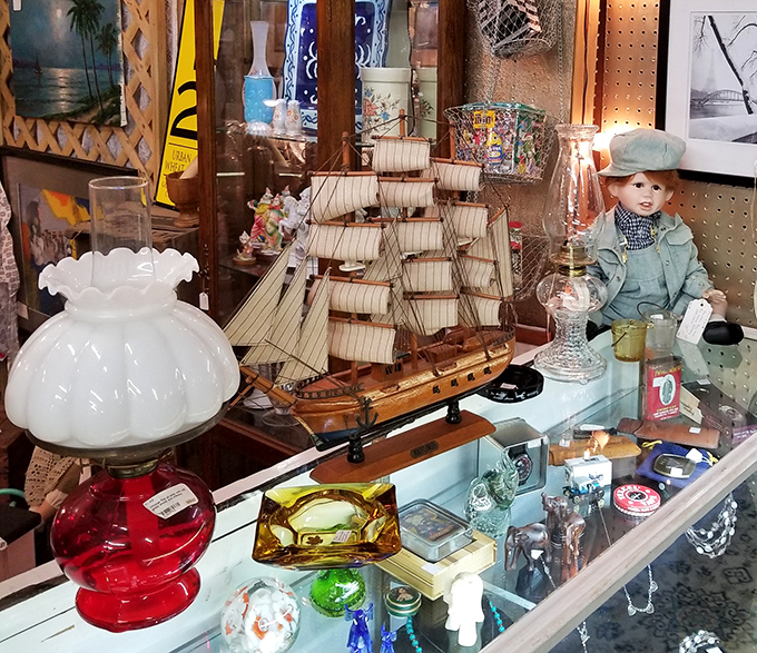 Nautical nostalgia anchors this display. That model ship probably sailed through countless living rooms before docking at this antique mall.