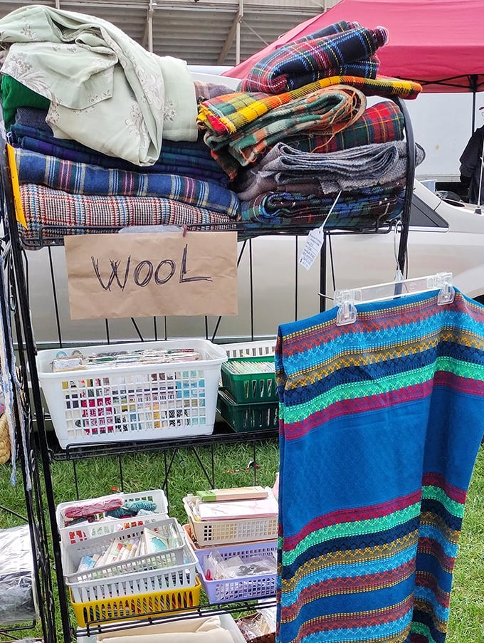 A "wool" sign that barely contains its colorful bounty of vintage fabrics, each with potential to become that statement throw your living room needs.