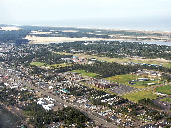 Coastal living that won't sink your savings! Florence's aerial view showcases its perfect blend of ocean, river, and affordable neighborhoods.