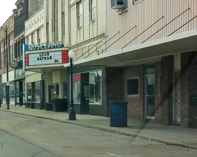 Pana's classic small town streetscape showcases perfectly preserved buildings, with a vintage car completing the nostalgic scene.