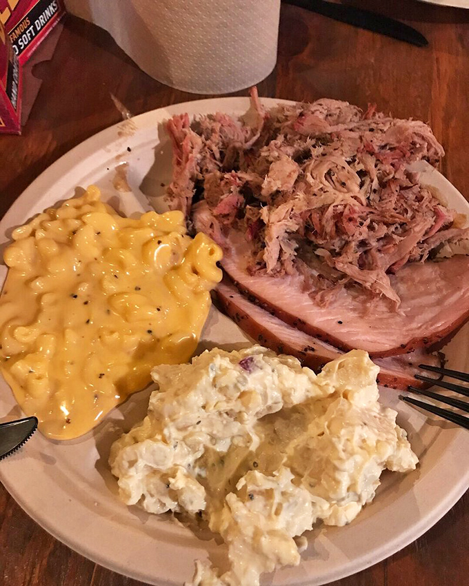 The carnivore's dream plate: multiple meats, multiple sides, multiple reasons to loosen your belt before you even start.