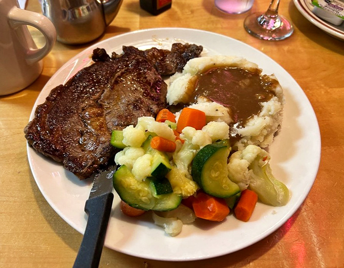 A ribeye steak plate that answers the eternal question: "Can I have dinner for breakfast?" with a resounding "Yes, and here's gravy too."