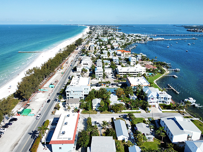 The island reveals its slender profile from above, with Gulf waters on one side, bay on the other. A delicious sandwich of land between two blue slices.