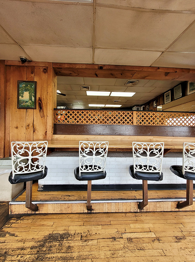 Counter seating with ornate white chair backs offers the perfect perch for sandwich contemplation and people-watching between bites.