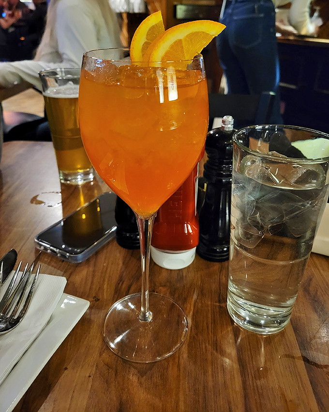 An Aperol Spritz that glows like a Cleveland sunset, bringing a touch of Italian aperitivo culture to Detroit Road.