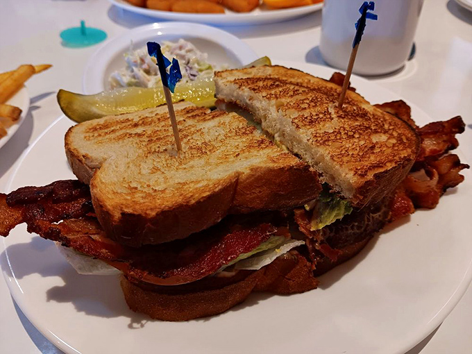 The BLT that ate Manhattan. Perfectly toasted bread, crispy bacon, and all the fixings secured with those little plastic swords that make everything taste better.