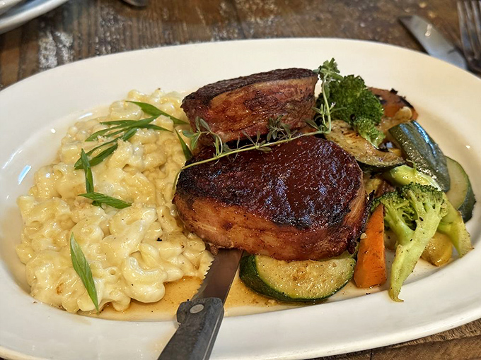 Bacon-wrapped meatloaf that would make your grandmother simultaneously proud and jealous. Served with creamy risotto and seasonal vegetables that aren't just an afterthought.