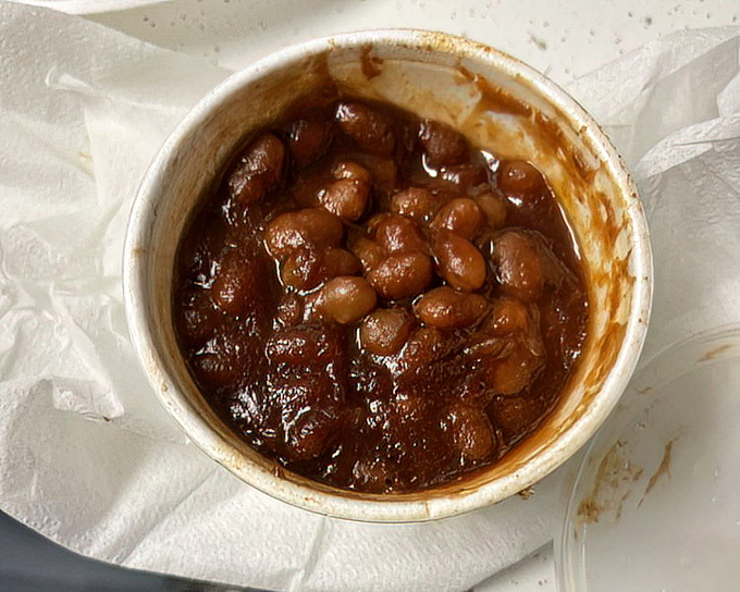 Baked beans that have clearly been hanging out with the brisket. They've absorbed all the right influences and made some delicious life choices.