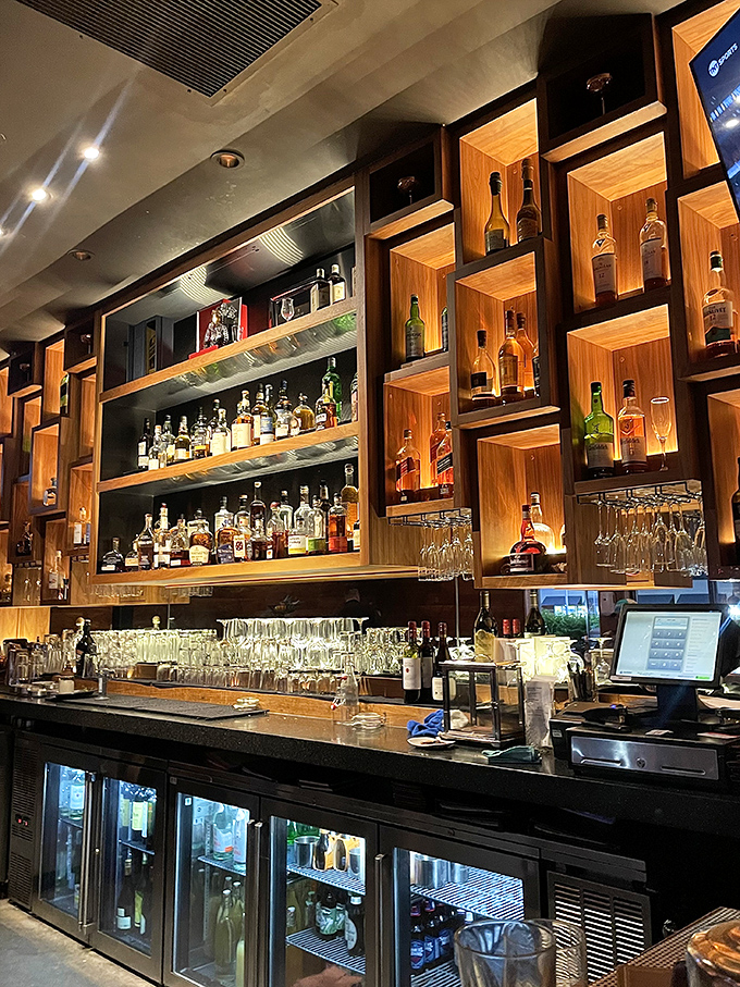 The bar at Sullivan's doesn't just serve drinks; it crafts liquid masterpieces in a setting worthy of a modern-day Mad Men episode.