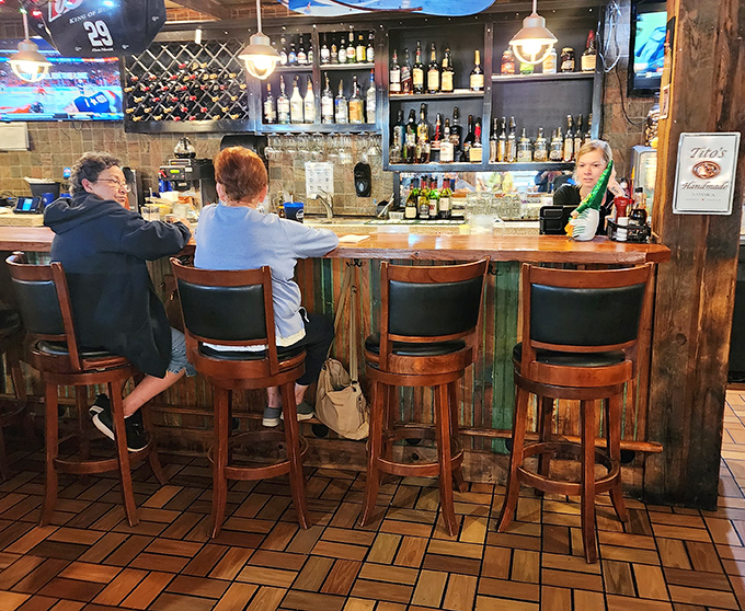 The bar area&mdash;where sweet tea and something stronger flow with equal enthusiasm. Those wooden stools have supported countless satisfied customers.
