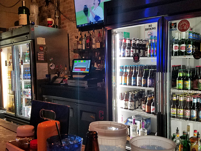 The bar area&mdash;where magic happens one pour at a time. That impressive beer selection proves they care about what goes in your glass as much as on your plate.