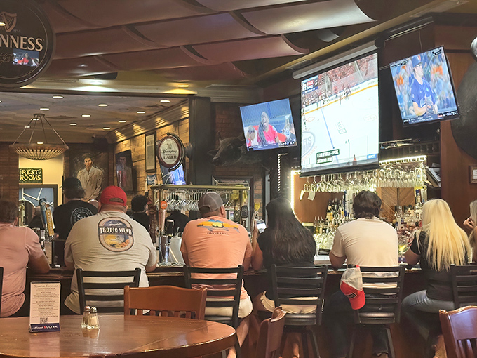 The bar seating area&mdash;where strangers become friends over cold drinks and hot takes on whatever game is playing on those perfectly positioned TVs.