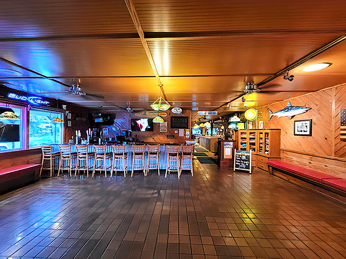 The bar area stands ready for those wise enough to arrive early, offering liquid patience while you wait for your table.