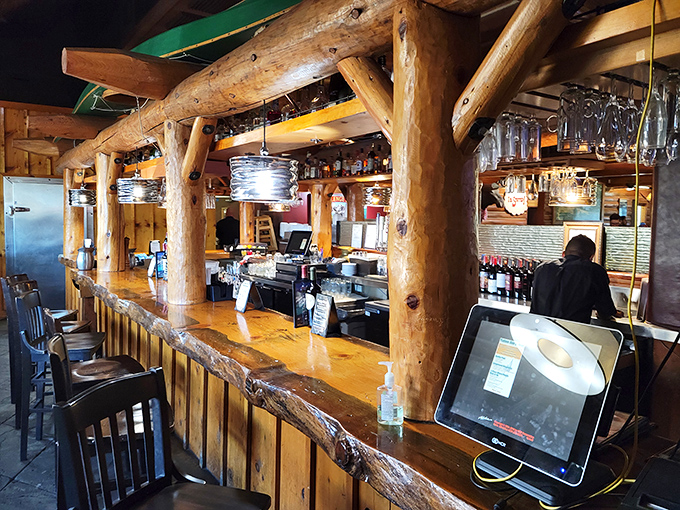 The bar's rough-hewn log construction wasn't just designed&mdash;it was crafted with the same attention to detail as their steaks. Those bar stools have supported countless "just one more" decisions.
