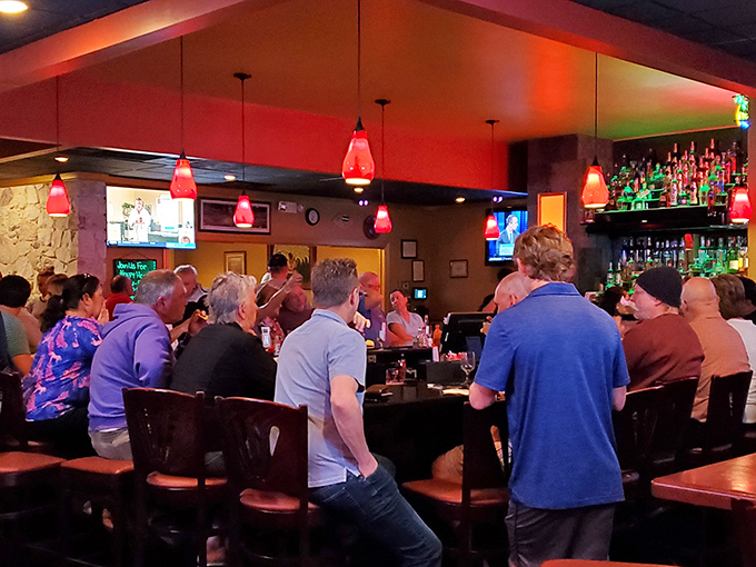 The bar area buzzes with energy as patrons gather for margaritas and conversation. It's where strangers become friends over shared plates and salt-rimmed glasses.