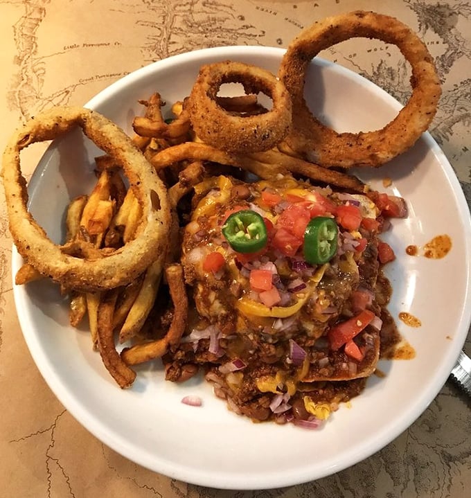 Bison chili nachos topped with fresh jalape&ntilde;os and colorful veggies&mdash;proof that sometimes the messiest foods create the most orderly happiness.