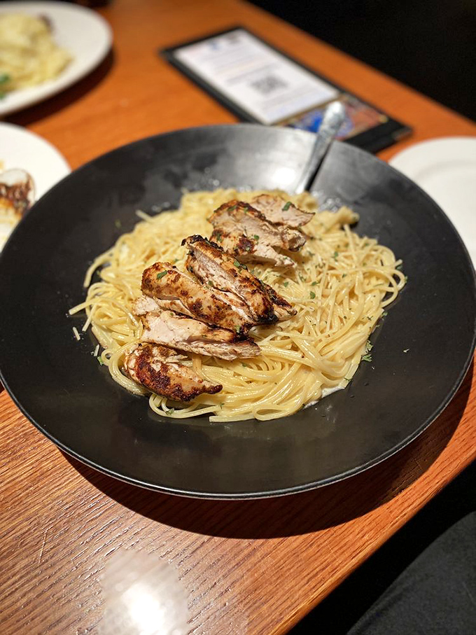 Simple pasta elevated by perfectly blackened chicken—proof that Coastal Grille understands that great seafood restaurants need land options too.
