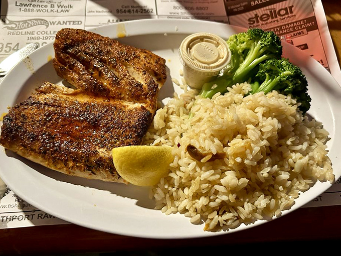 Blackened mahi that's been introduced to spices with proper respect. The fish and seasoning aren't fighting; they're dancing a perfectly choreographed tango.