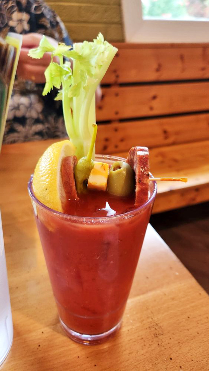 A Bloody Mary that's practically a meal itself, accessorized with celery, olives, and enough garnish to qualify as a small salad.