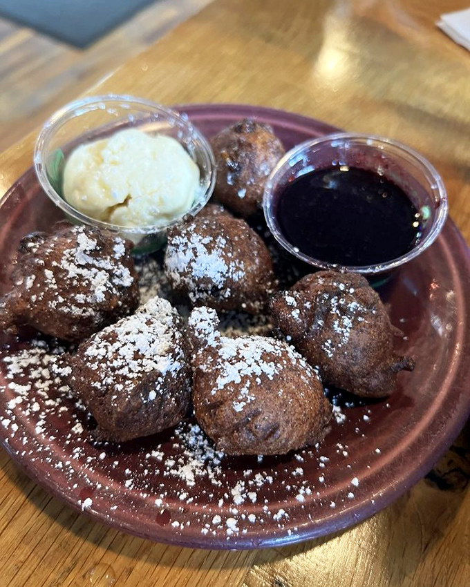 These blueberry hush puppies aren't telling secrets, but they might make you whisper sweet nothings between bites of powdered perfection. 