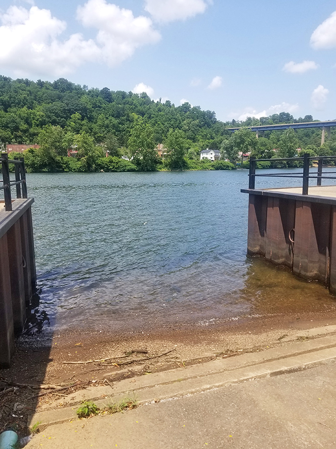 The simple boat launch offers direct access to the Monongahela's gentle current – nature's highway that still beckons adventurers.