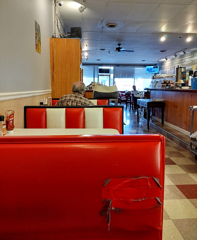 Those red and white booths have absorbed decades of laughter, gossip, and the occasional "I shouldn't have room for dessert, but..."