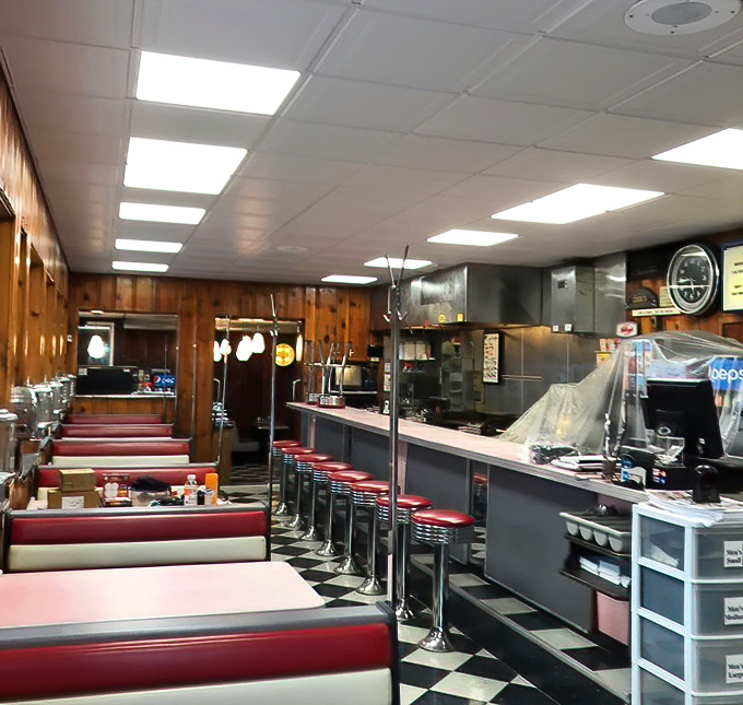 The counter versus booth debate continues in this classic diner setup. Choose wisely&mdash;your breakfast experience depends on it.
