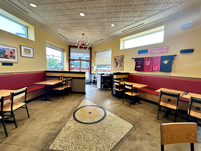 Red booths and sunny yellow walls create the perfect backdrop for morning philosophizing or planning your next meal while enjoying this one.