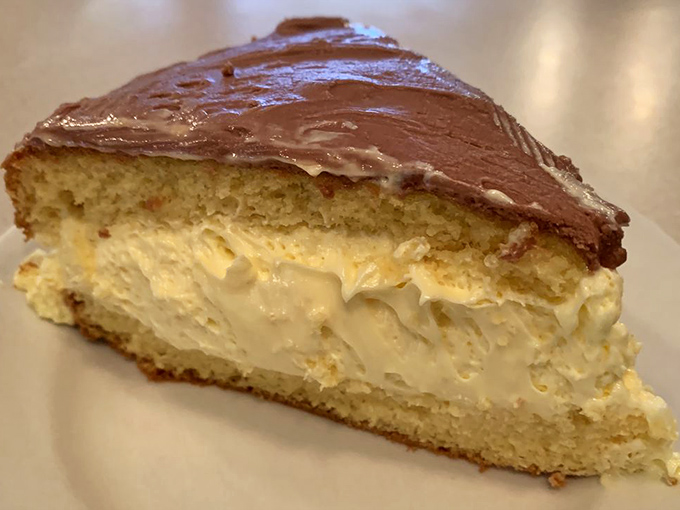 Boston cream pie that doesn't need Boston to be authentic. The custard center is generous, the chocolate topping glossy, and the cake itself impossibly light.